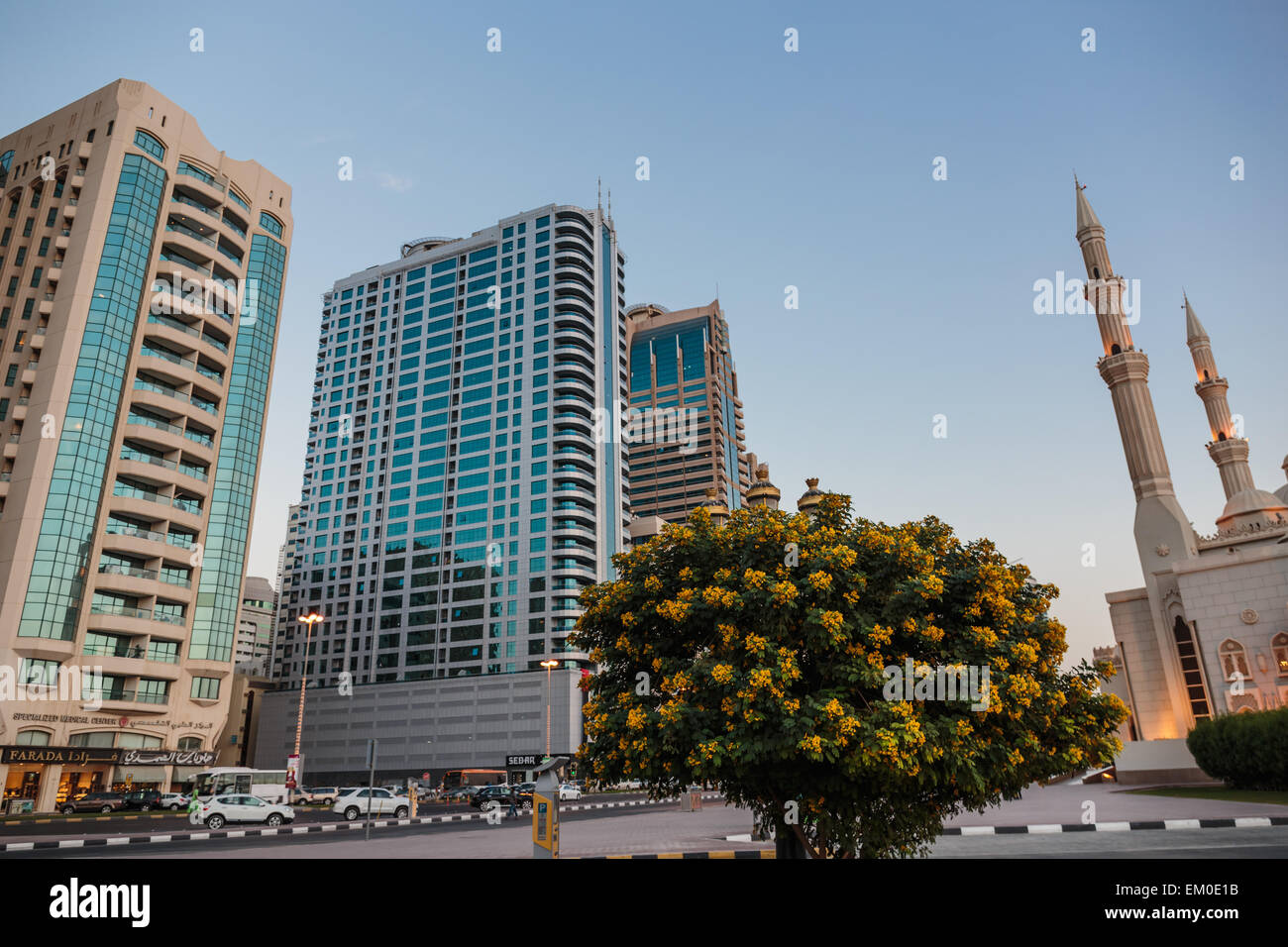 SHARJAH, UAE - NOVEMBER 6, 2013: Modern buildings in Sharjah. It is the ...
