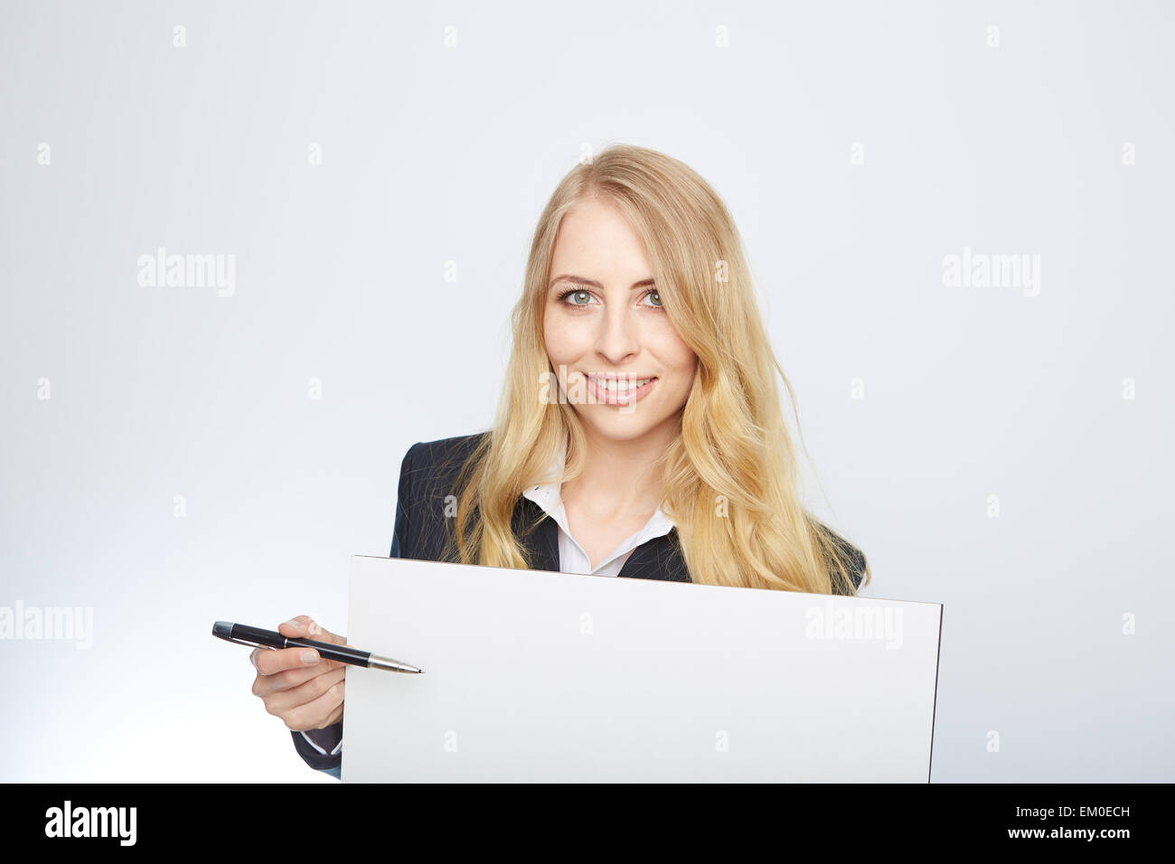 Pretty blonde girl with a blank presentation board Stock Photo - Alamy