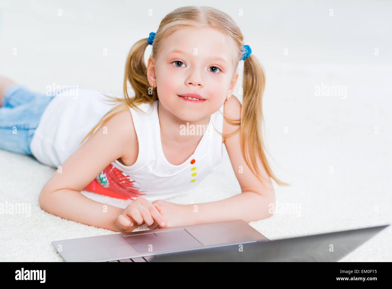 Pretty girl working on a laptop Stock Photo - Alamy
