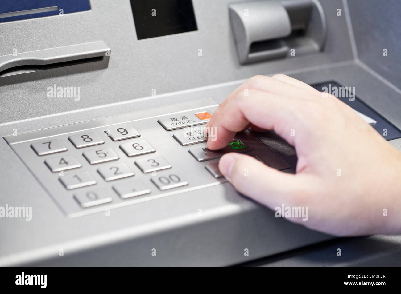 Human hand enter atm banking cash machine pin code Stock Photo - Alamy