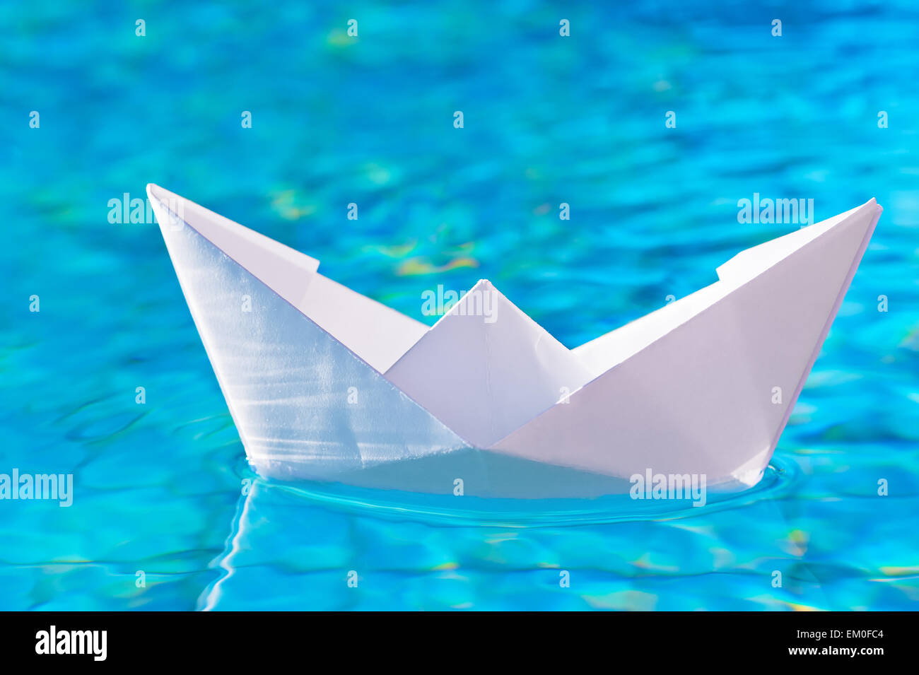 paper boat on the water in the pool Stock Photo - Alamy