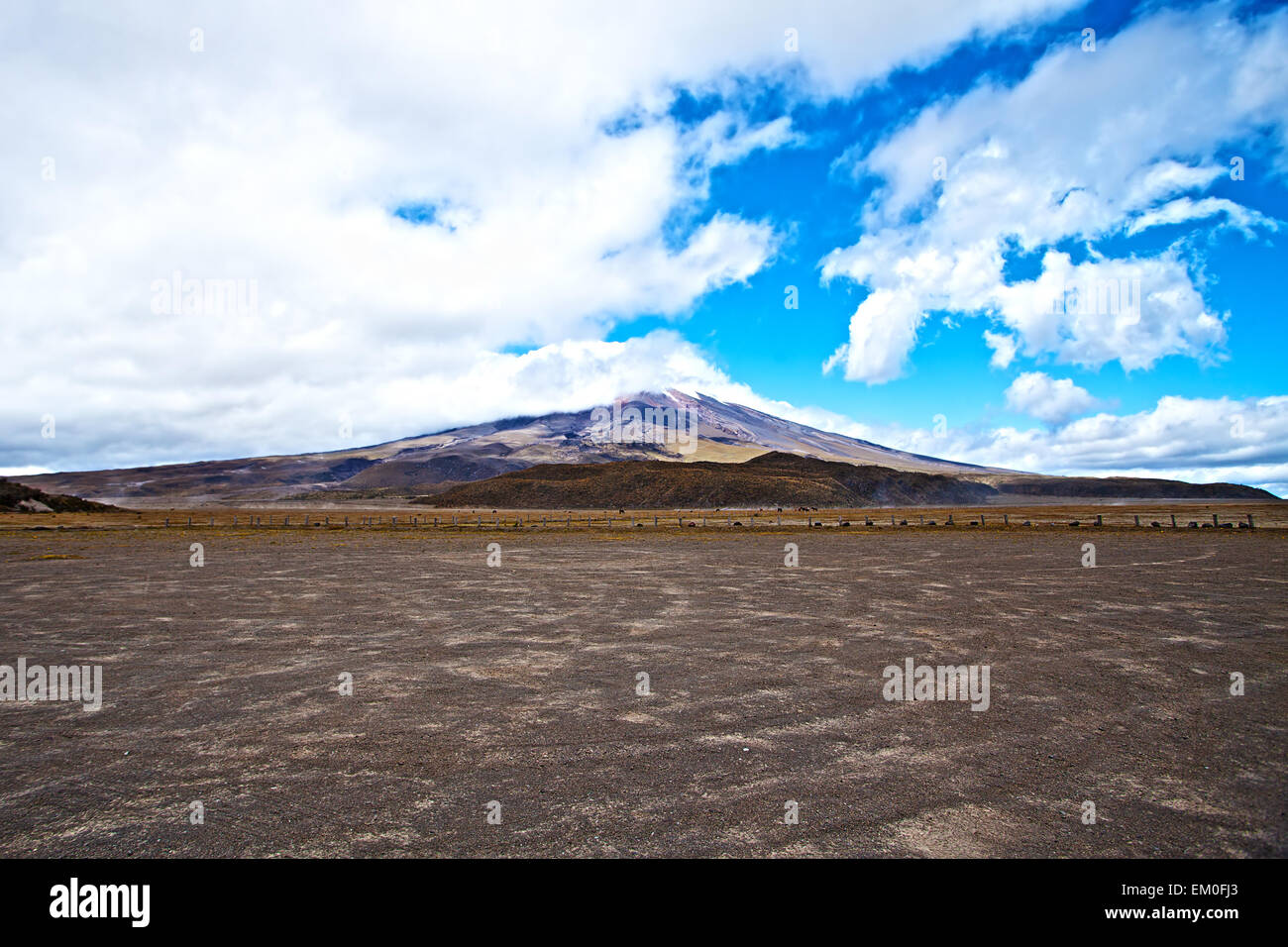 Cotopaxi Volcano in the background of blue sky and clouds Stock Photo ...