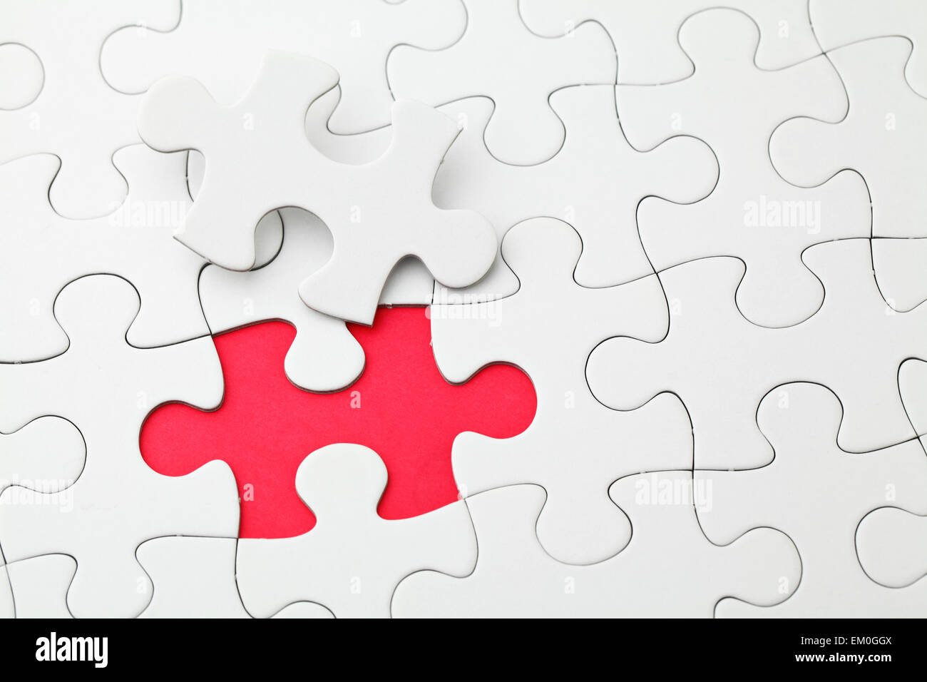 Puzzle with missing piece in red color Stock Photo - Alamy