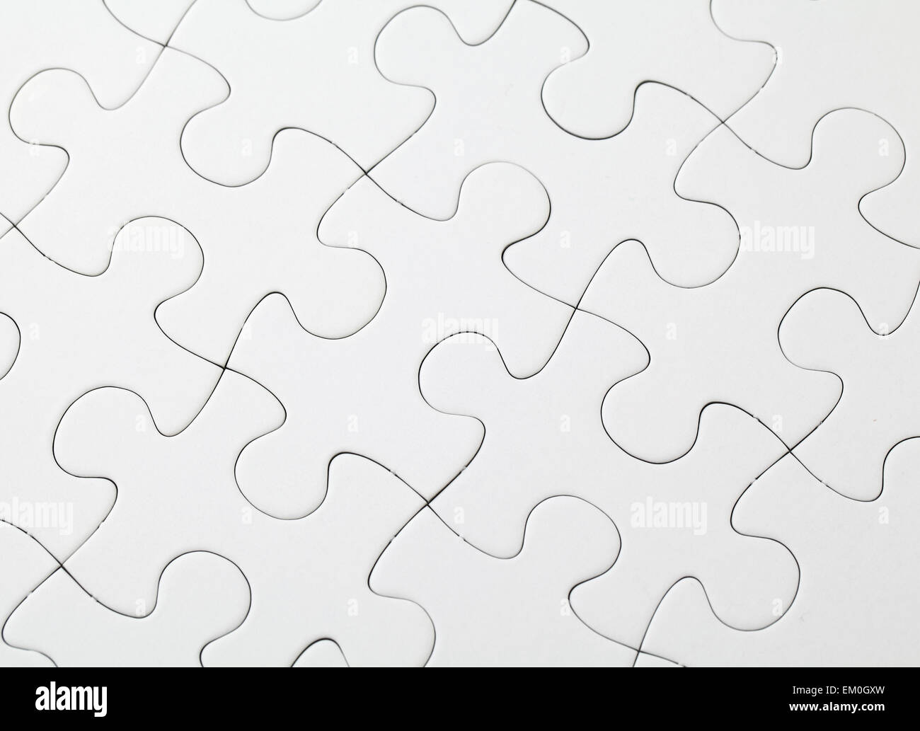 Part of completed white puzzle Stock Photo - Alamy
