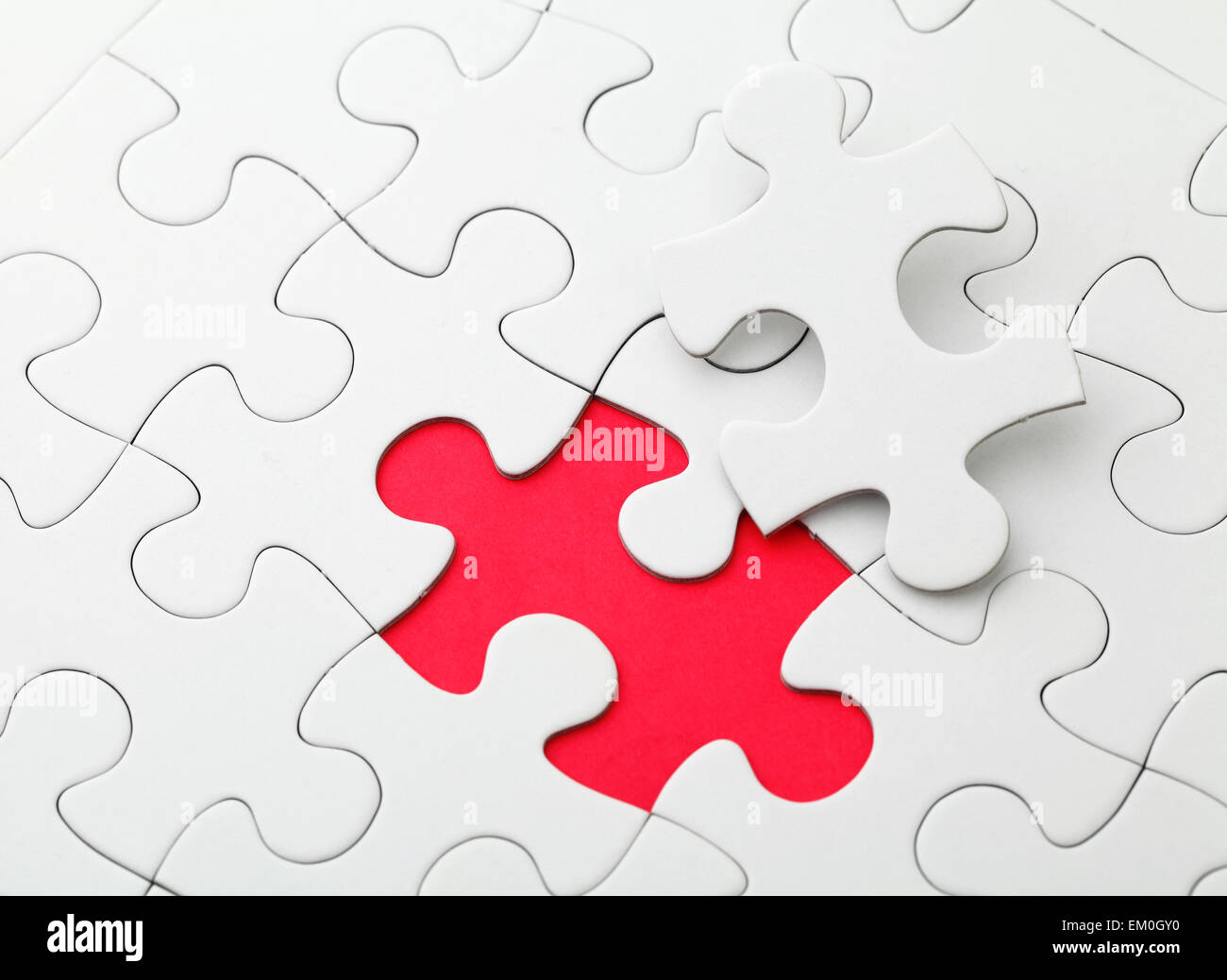 Puzzle with missing piece in red color Stock Photo - Alamy