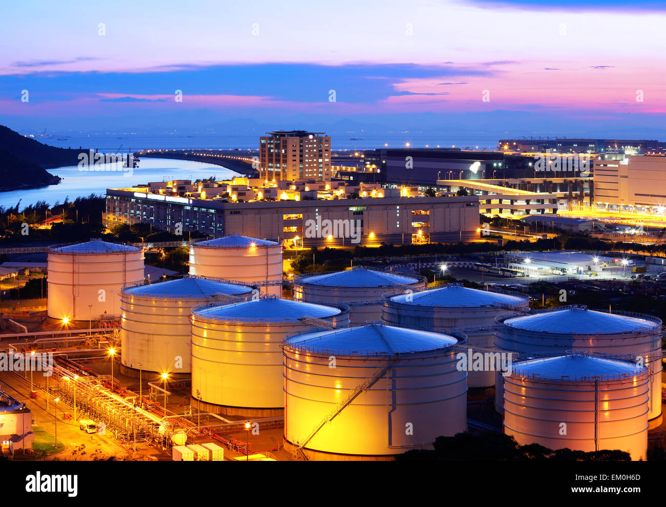 Oil tank at night Stock Photo - Alamy