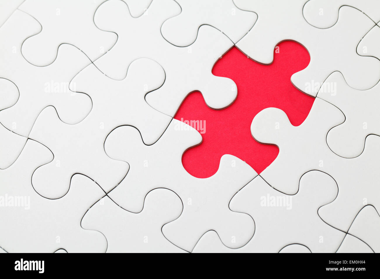 Missing puzzle piece in red Stock Photo - Alamy