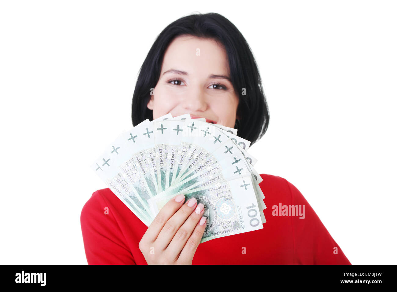 Cheerful young lady holding cash Stock Photo - Alamy