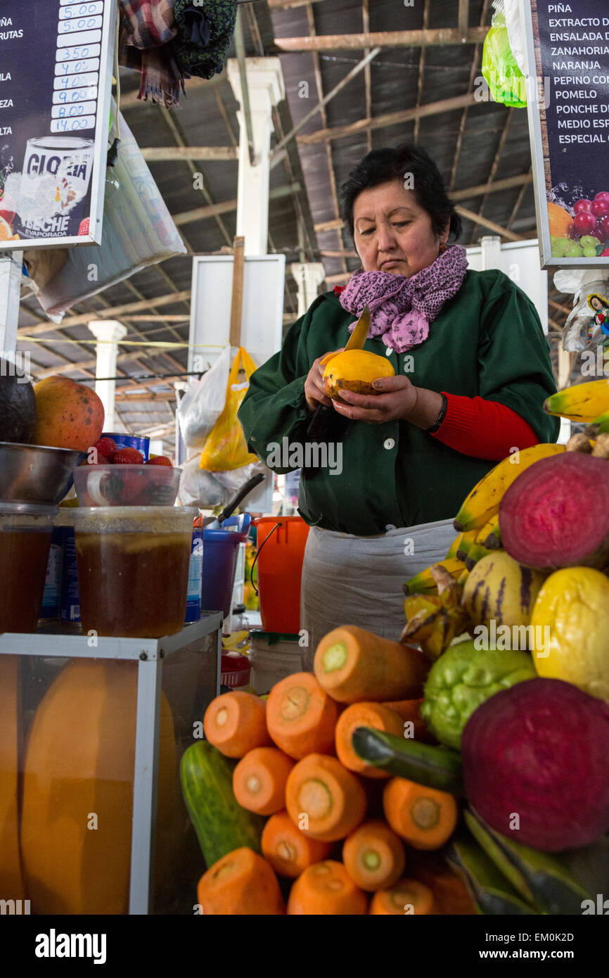 Peru, Cusco, San Pedro Market. Juice Vendor Preparing Mango Juice Stock ...