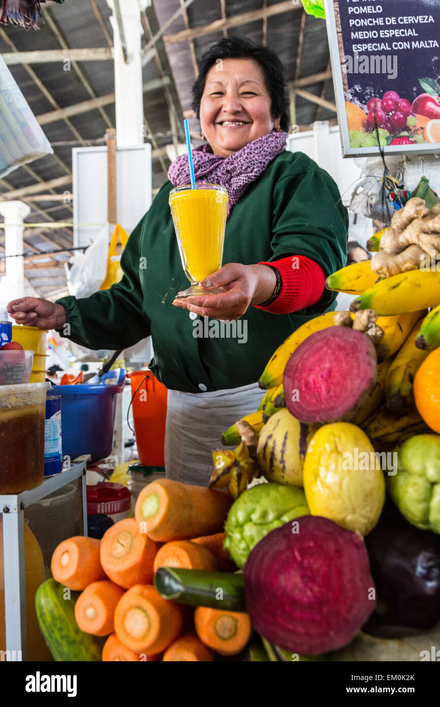 Peru, Cusco, San Pedro Market. Juice Vendor Offering Mango Juice Stock ...