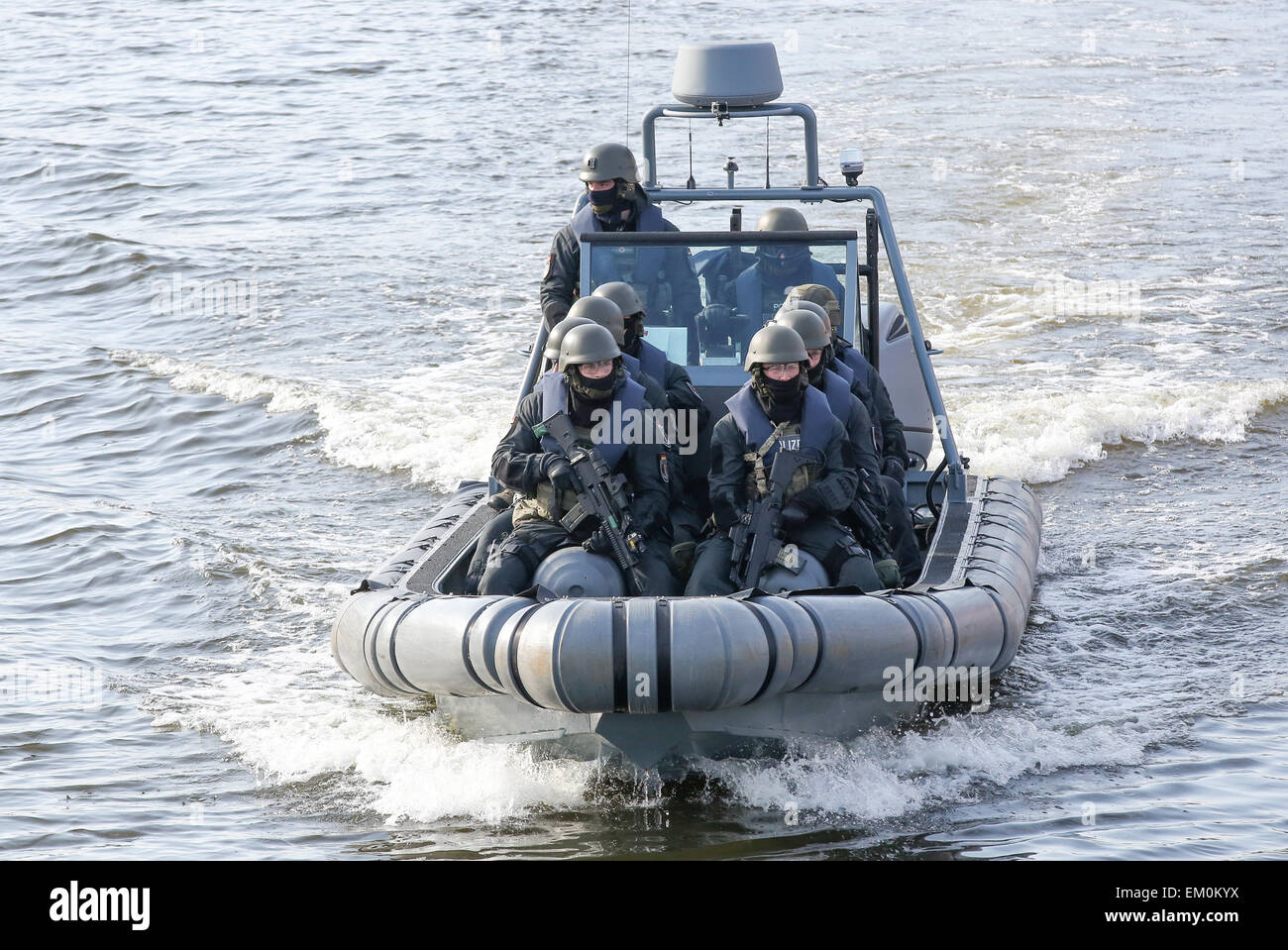 Luebeck, Germany. 15th Apr, 2015. Heavily armed police officers patrol ...