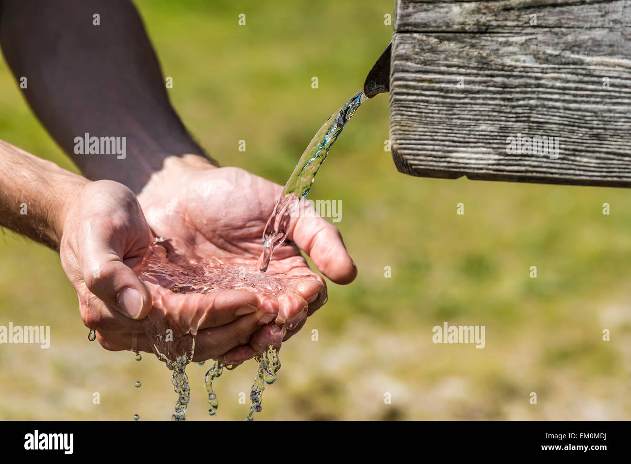 Wet hand in public fountain hi-res stock photography and images - Alamy