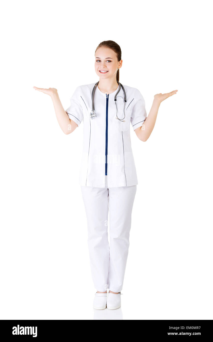 Medical doctor woman or nurse presenting and showing copy space Stock ...