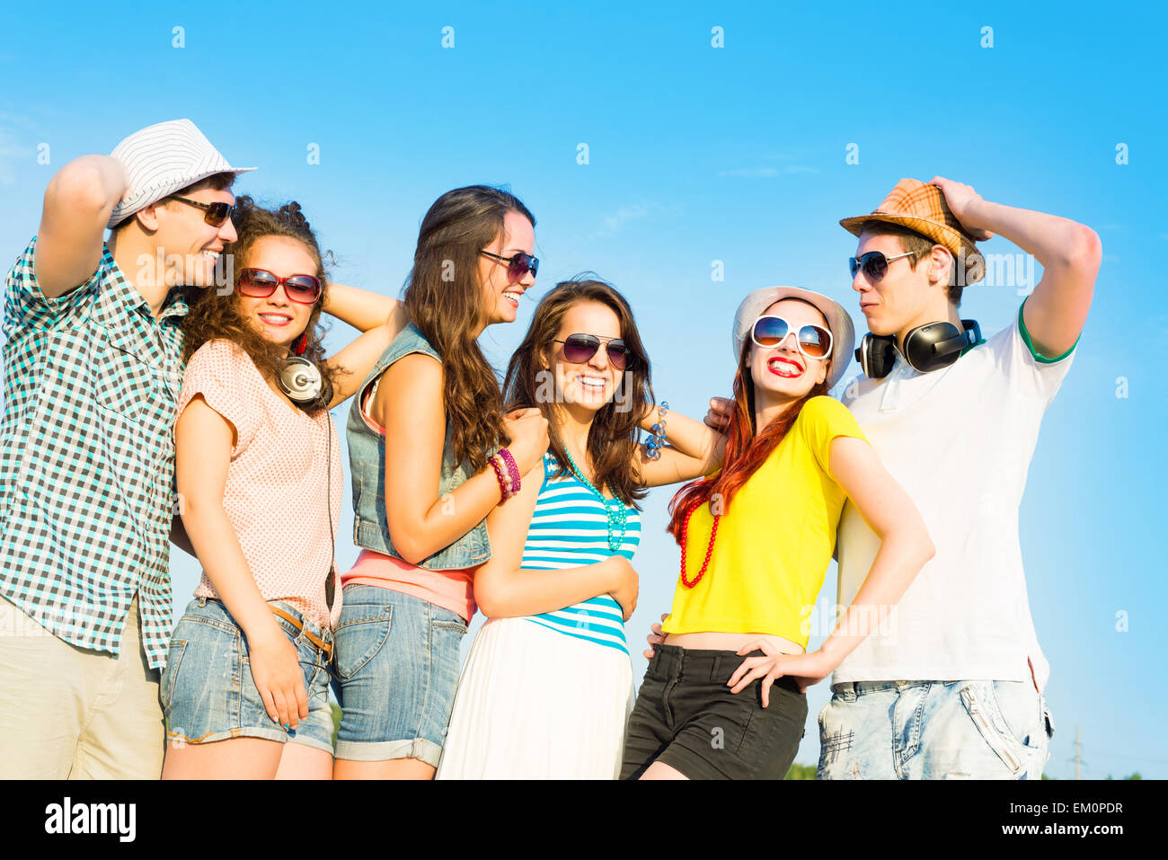 group of young people wearing sunglasses and hat Stock Photo - Alamy