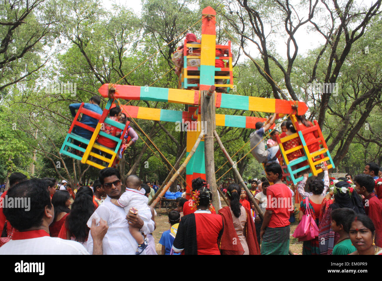 Dhaka, Bangladesh. 14th April, 2015. Bangladeshi children ride a merry ...