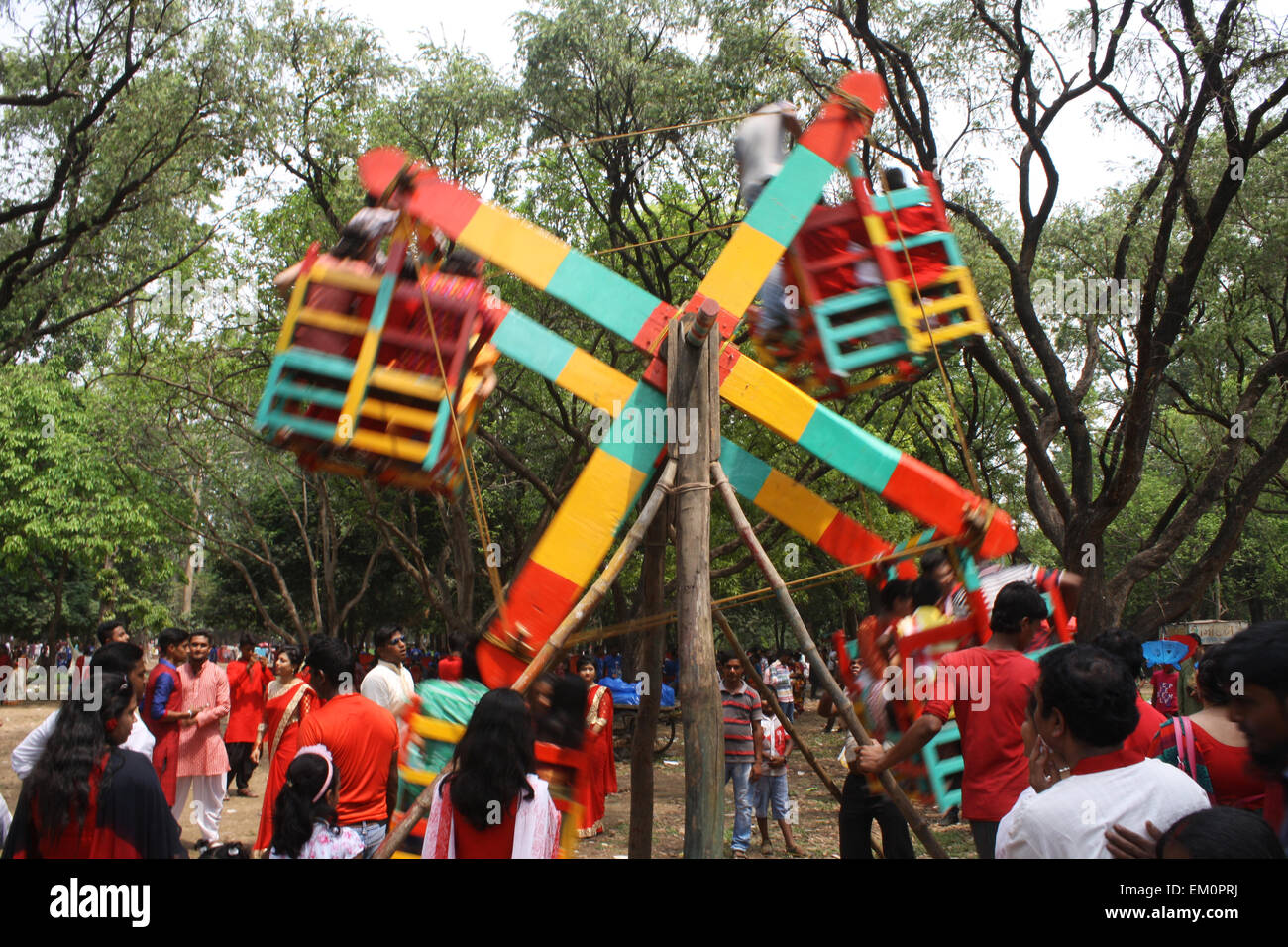 Dhaka, Bangladesh. 14th April, 2015. Bangladeshi children ride a merry ...