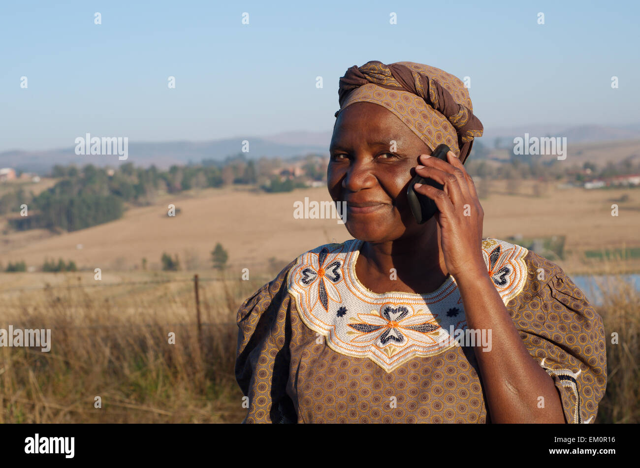 Traditional African Zulu woman speaking on mobile phone Stock Photo - Alamy