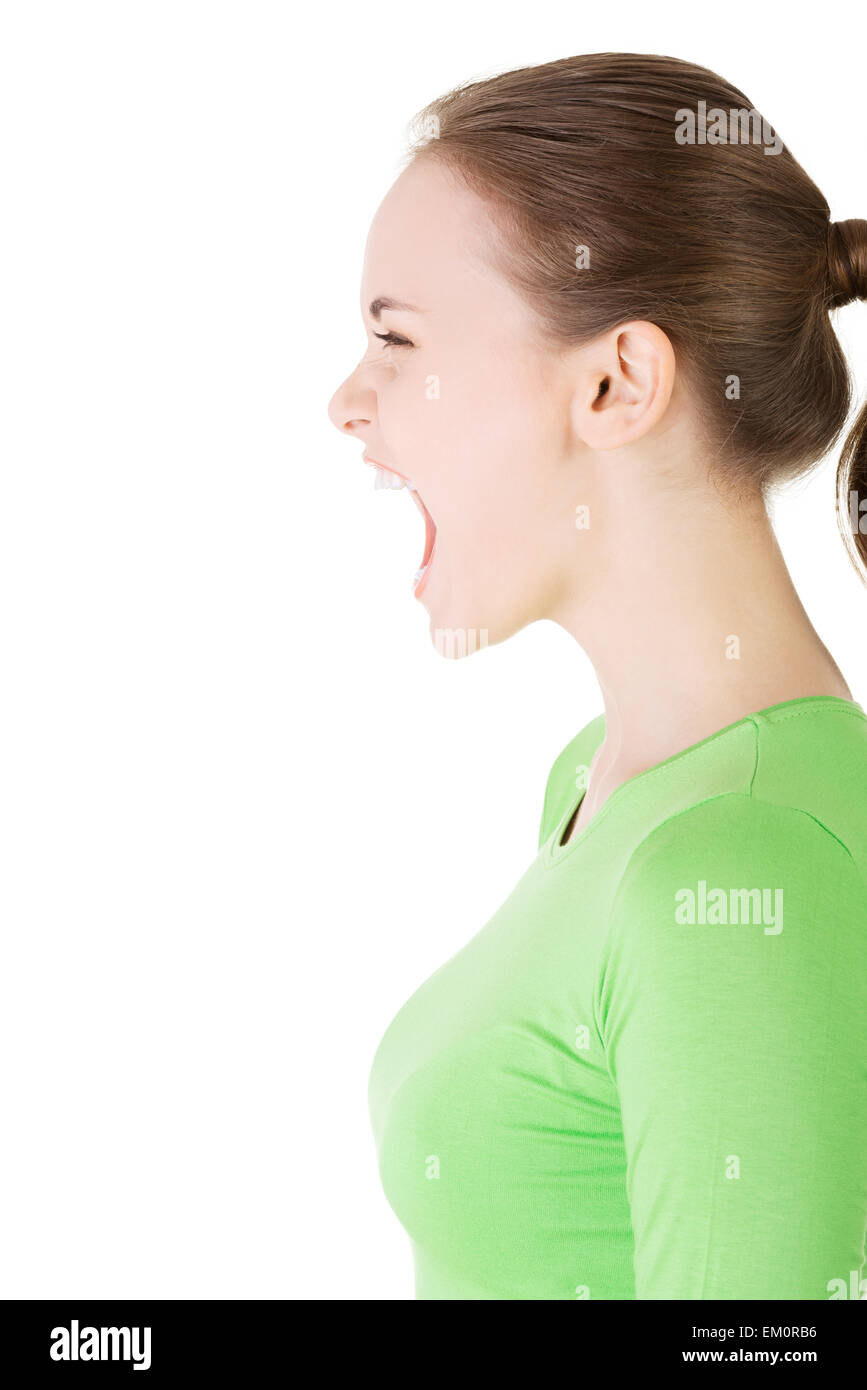 Young casual woman screaming with anger Stock Photo - Alamy