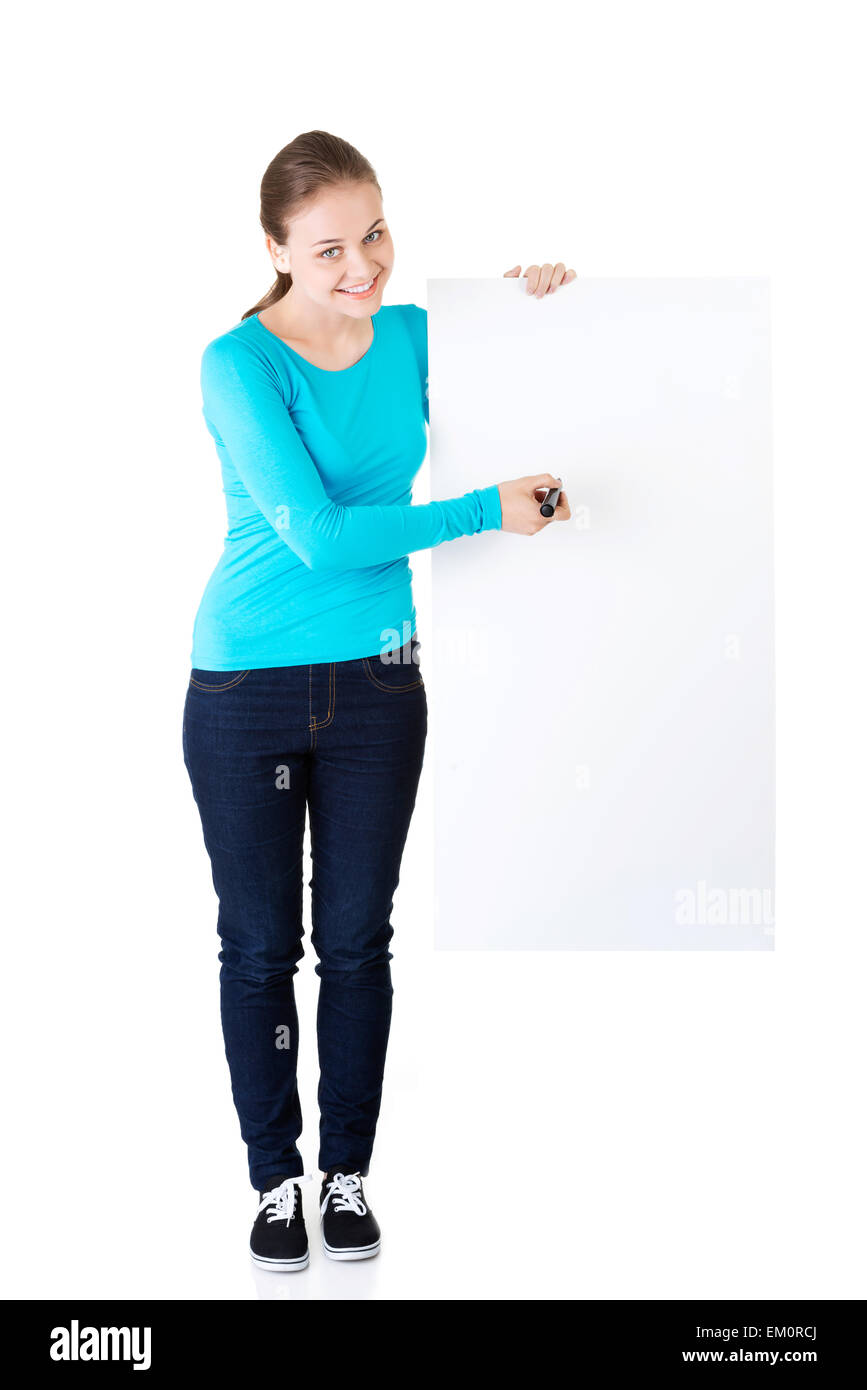 Happy beautiful woman writing with a pen on blank board Stock Photo - Alamy