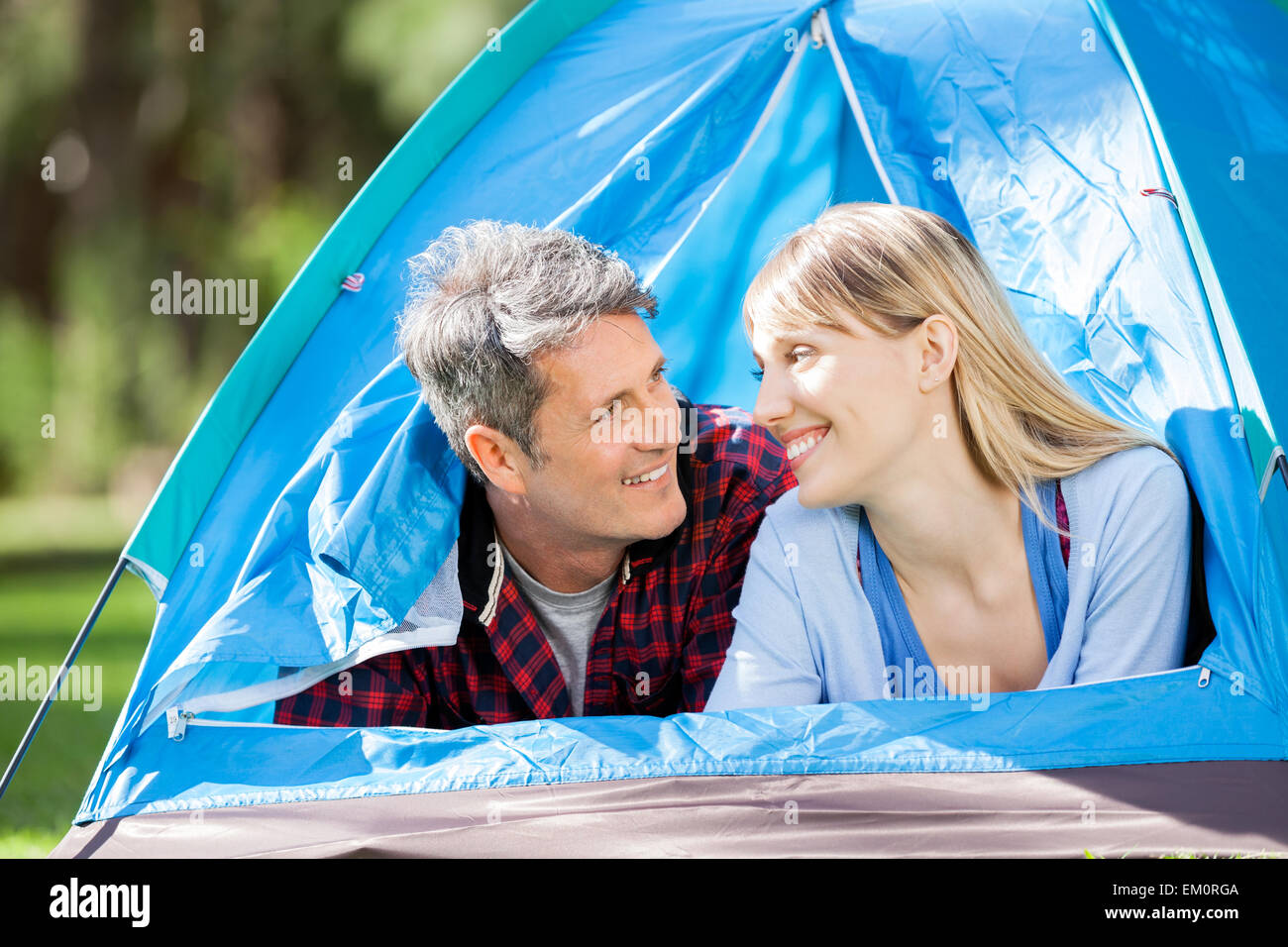 Romantic Couple In Tent At Park Stock Photo - Alamy