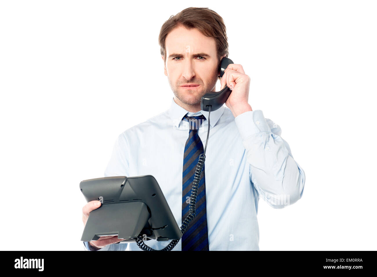 Business professional attending call Stock Photo - Alamy