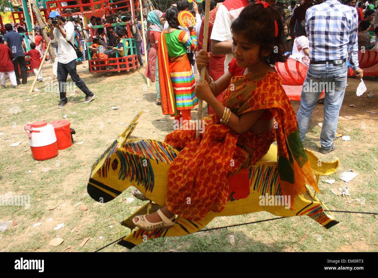 Dhaka, Bangladesh. 14th April, 2015. Bangladeshi children ride a merry ...