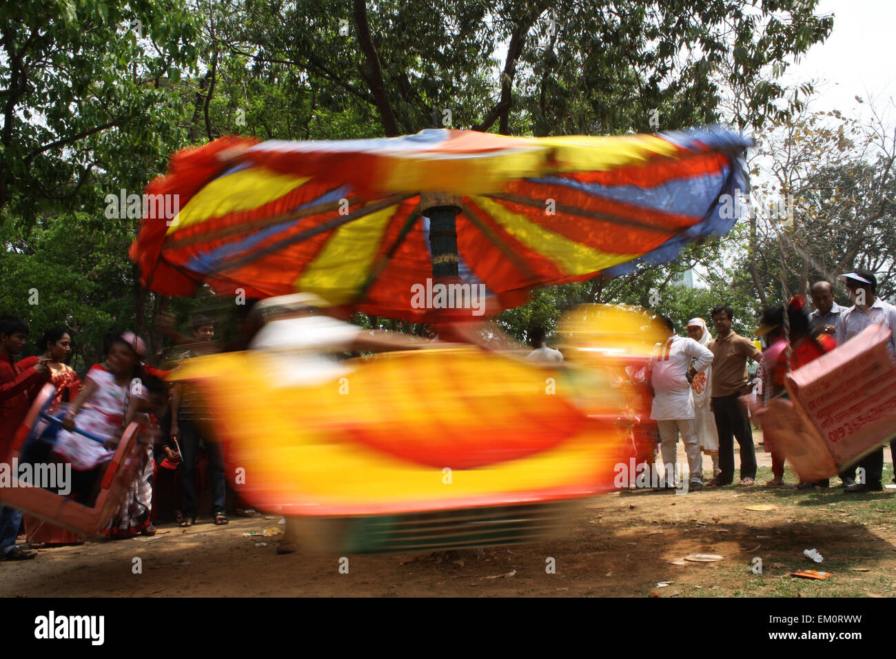Dhaka, Bangladesh. 14th April, 2015. Bangladeshi children ride a merry ...
