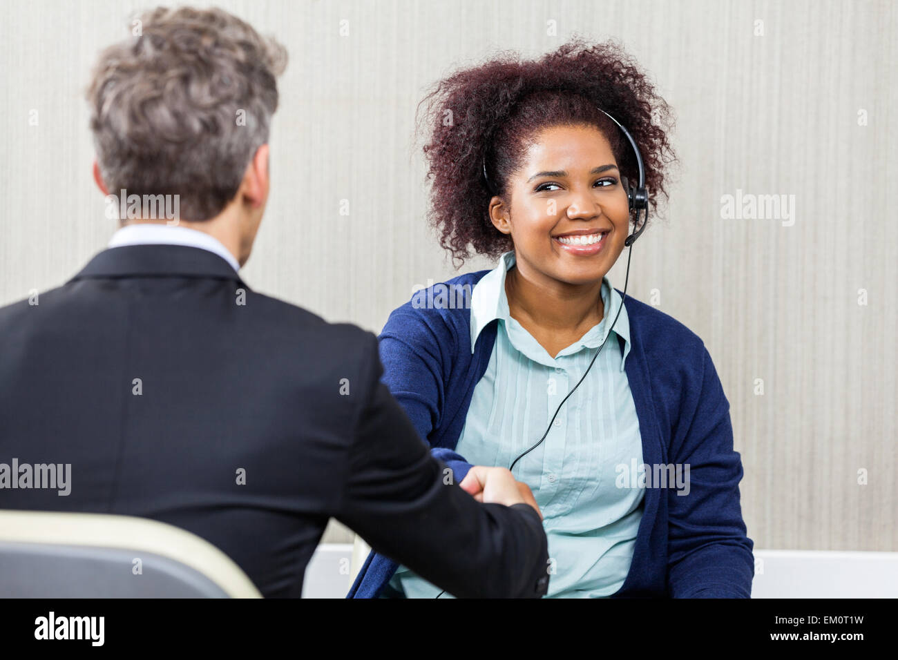 Young Female Customer Service Agent Shaking Hands With Manager Stock ...