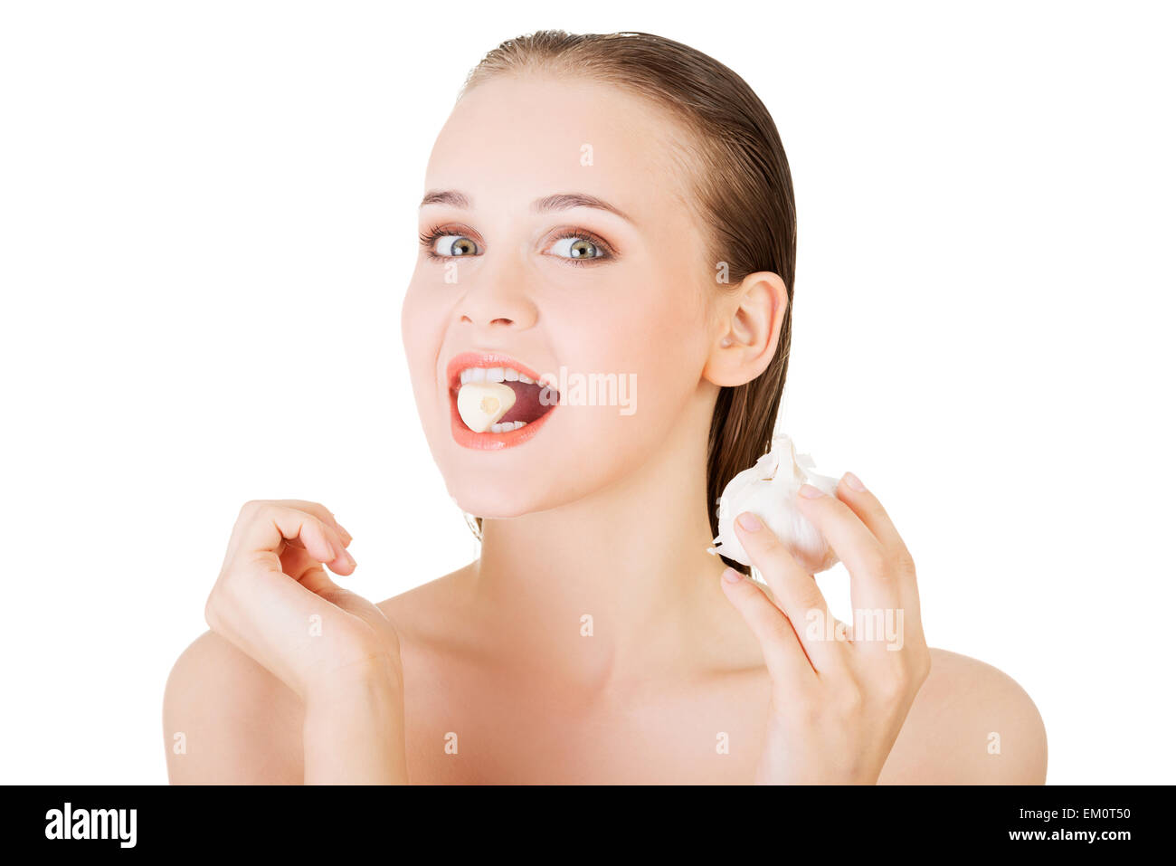 Young beautiful woman eating garlic hi-res stock photography and images ...