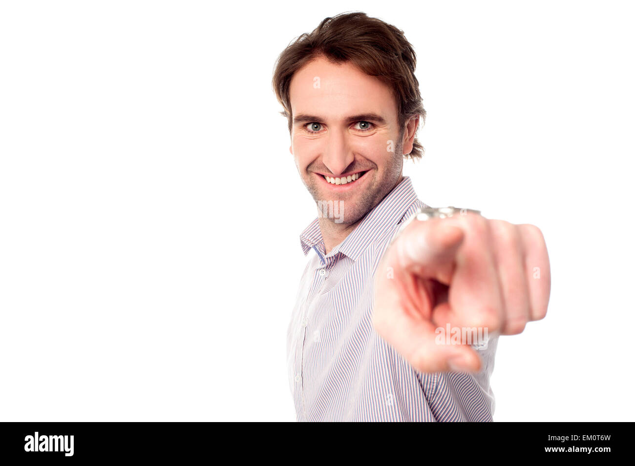 Cheerful man pointing towards camera Stock Photo - Alamy