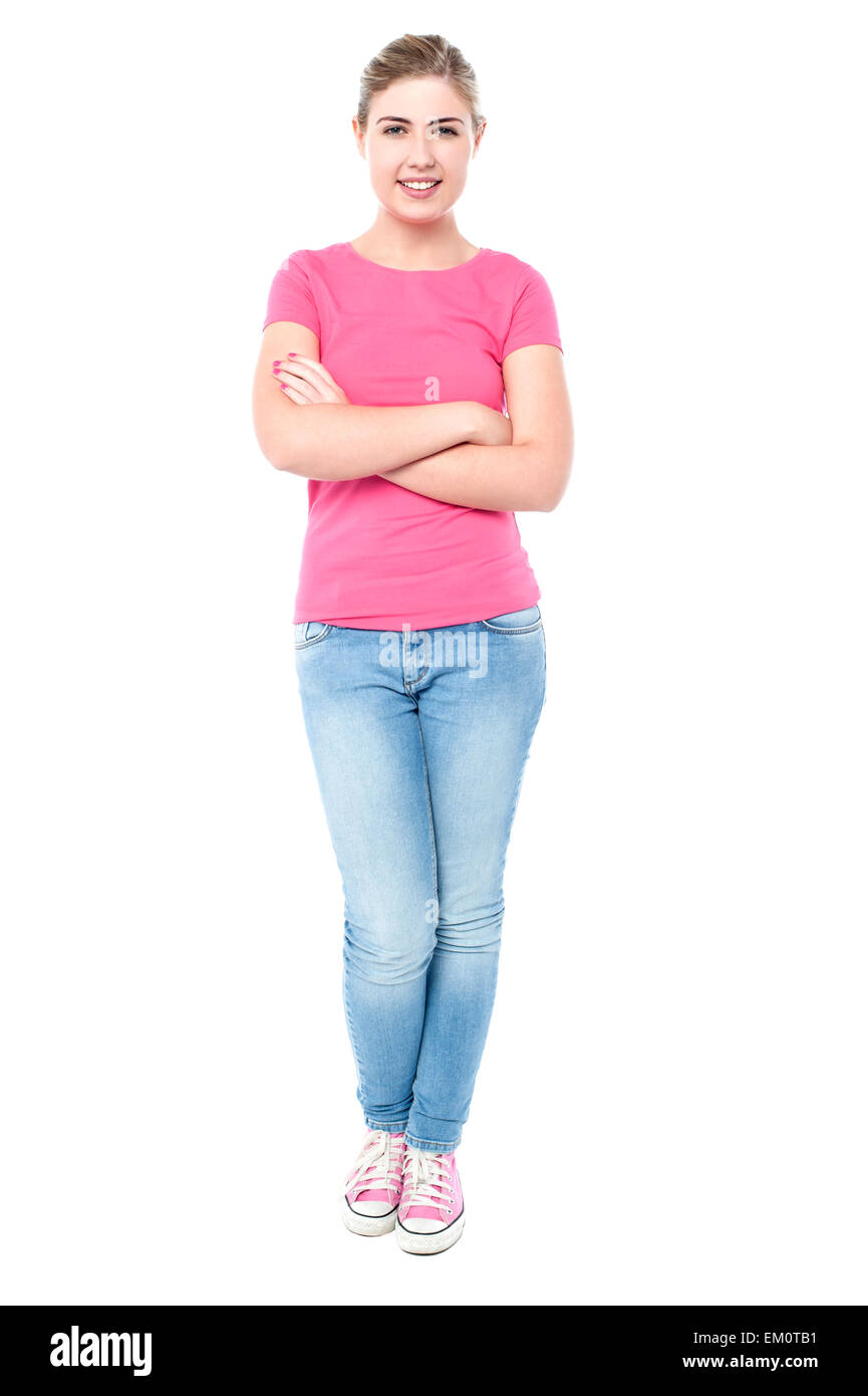 Casual young girl posing, arms crossed Stock Photo - Alamy