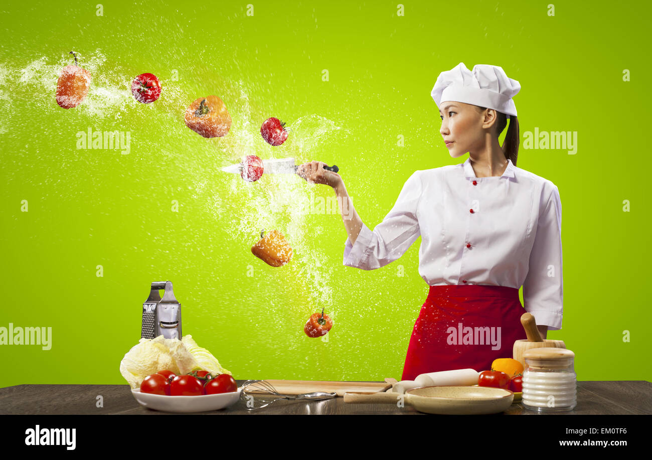 Asian female cook with knife Stock Photo - Alamy