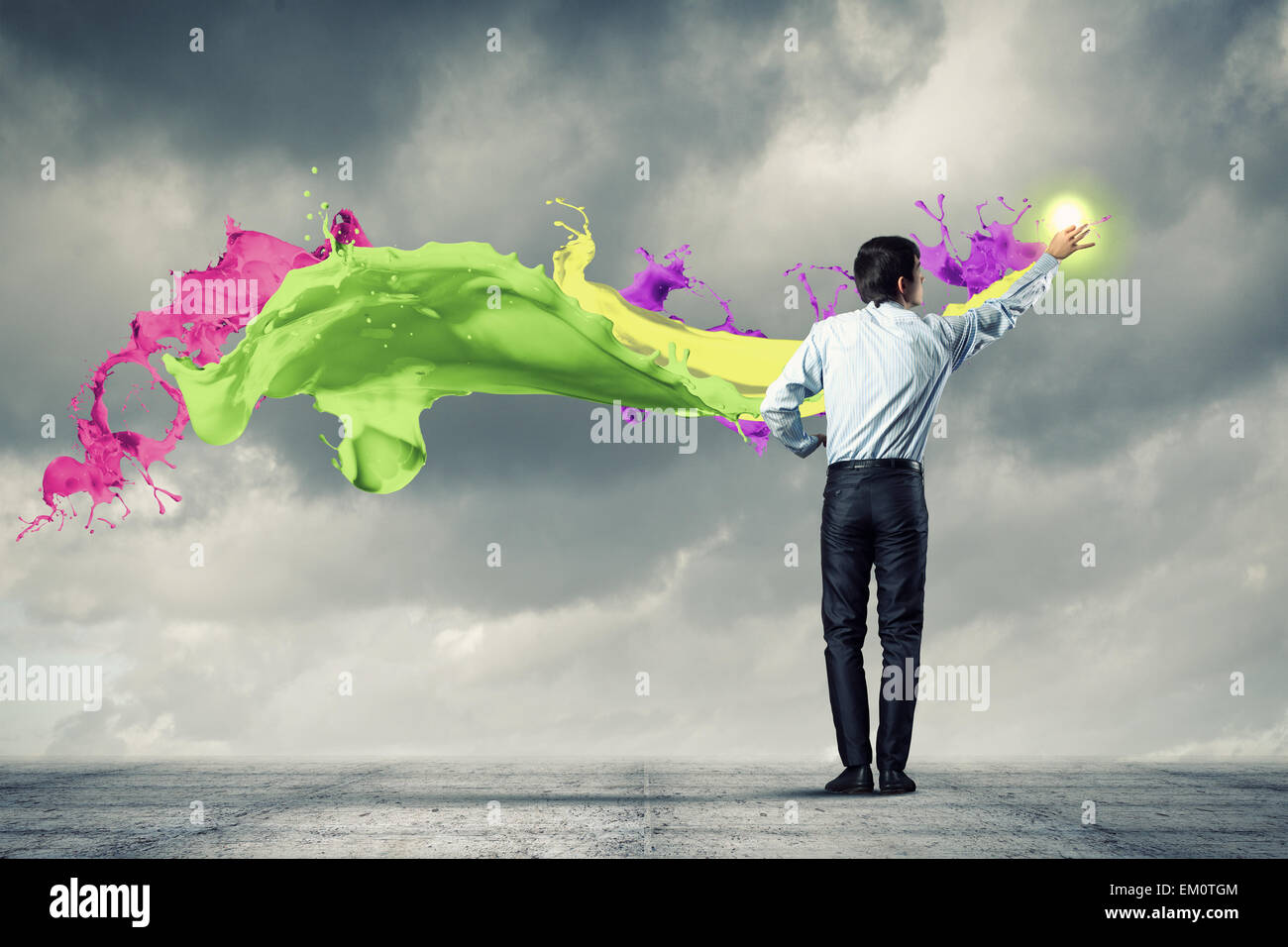 Man painting splashes Stock Photo - Alamy