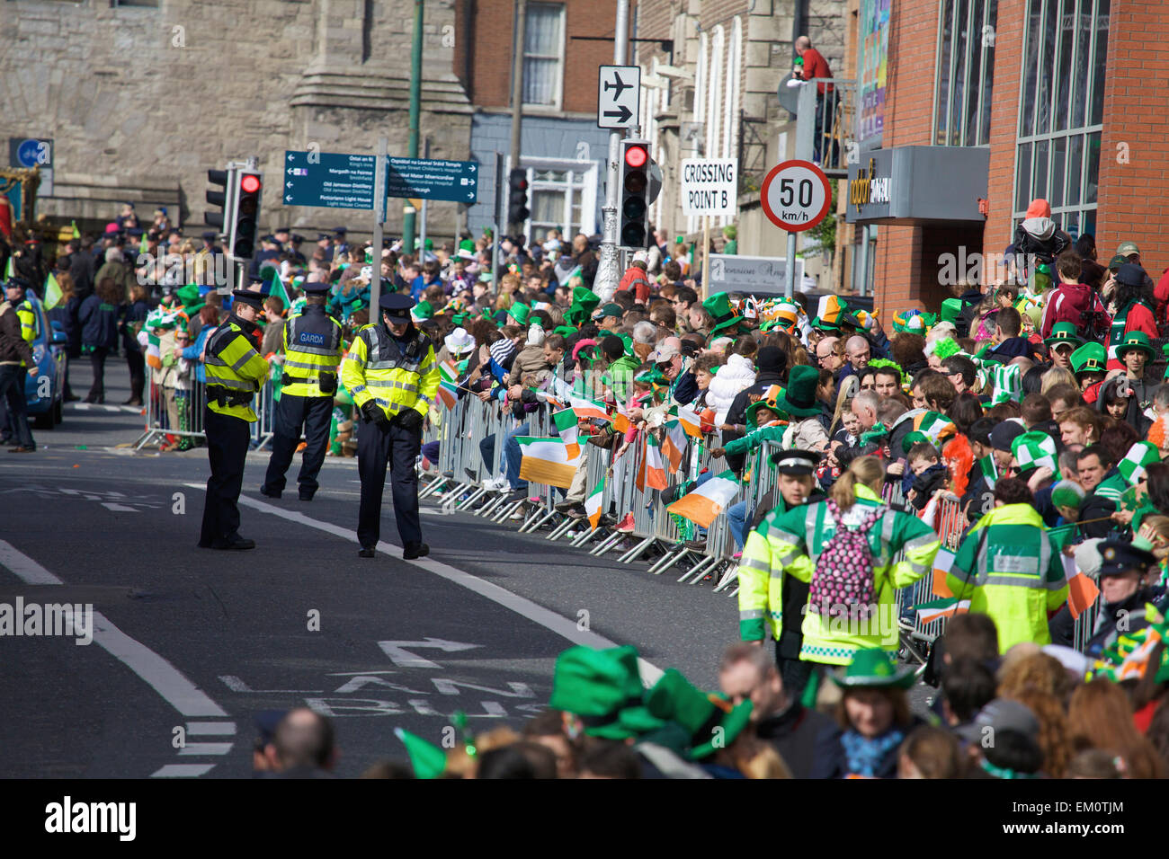 A Crowd And Police On The Street At The Saint Patrick S Day Parade