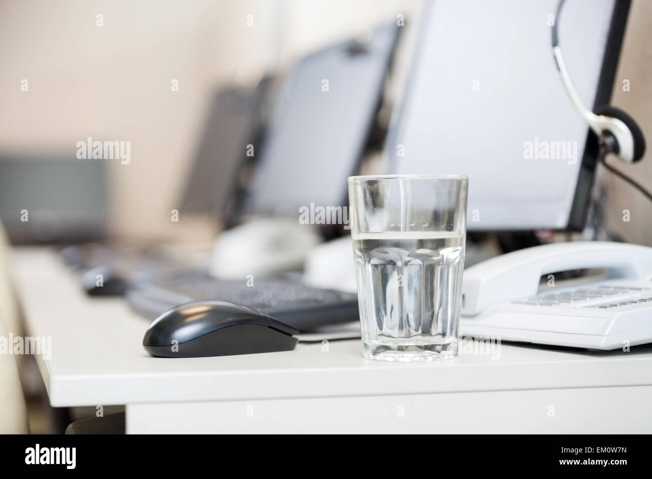 Water Glass On Desk At Call Center Stock Photo - Alamy