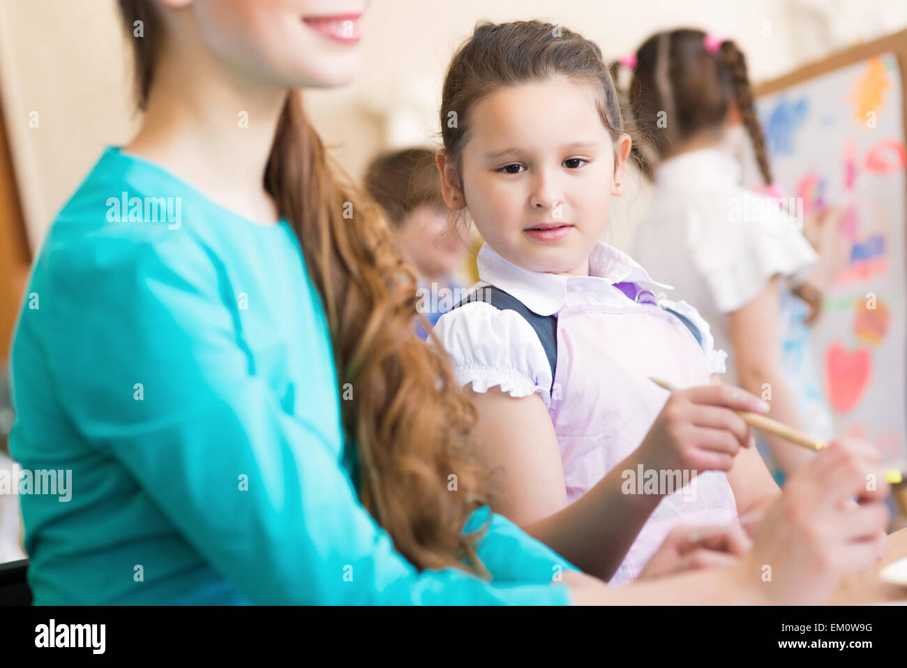 Children helping each other classroom hi-res stock photography and ...