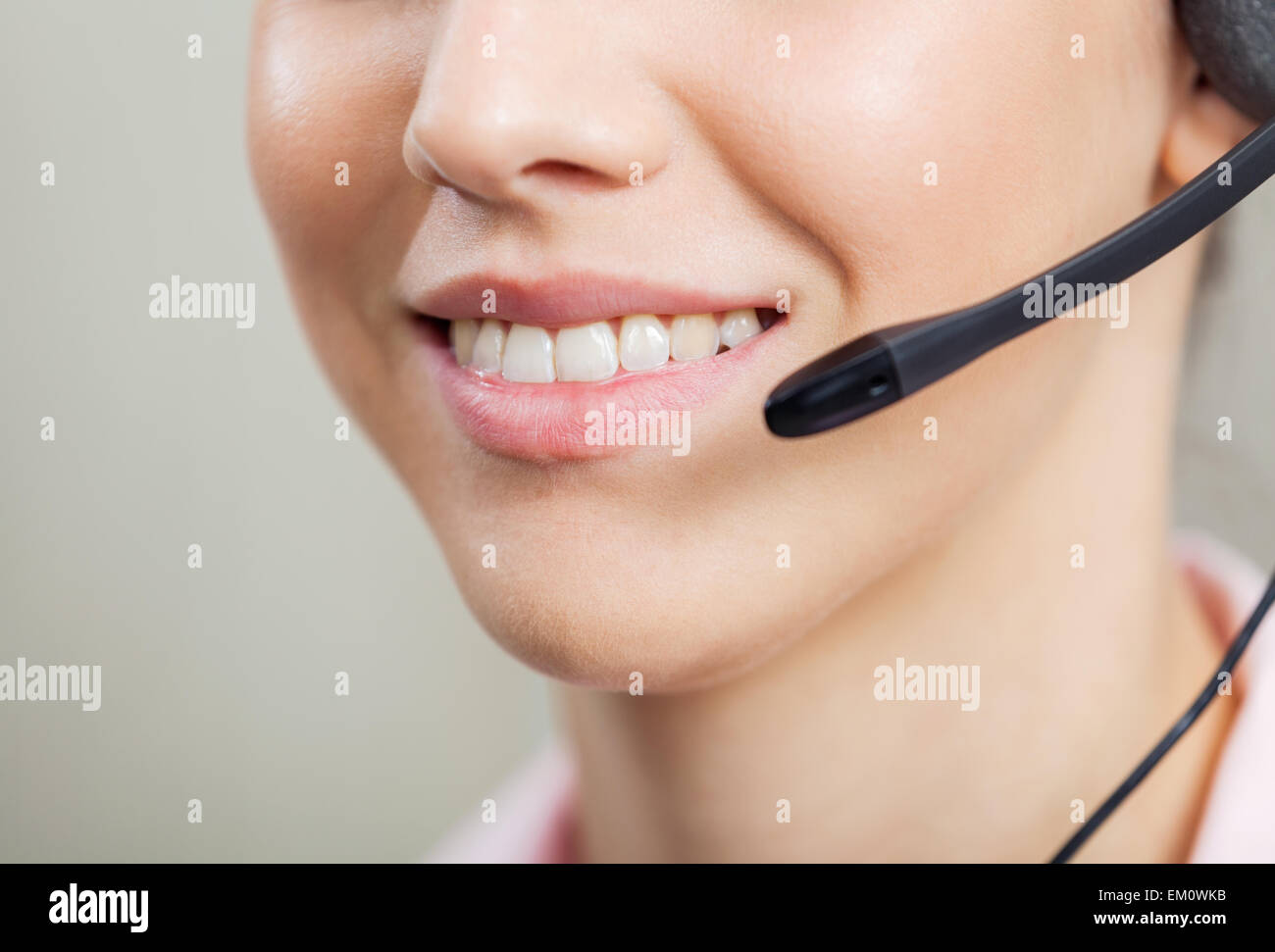 Smiling Female Customer Service Representative Stock Photo - Alamy