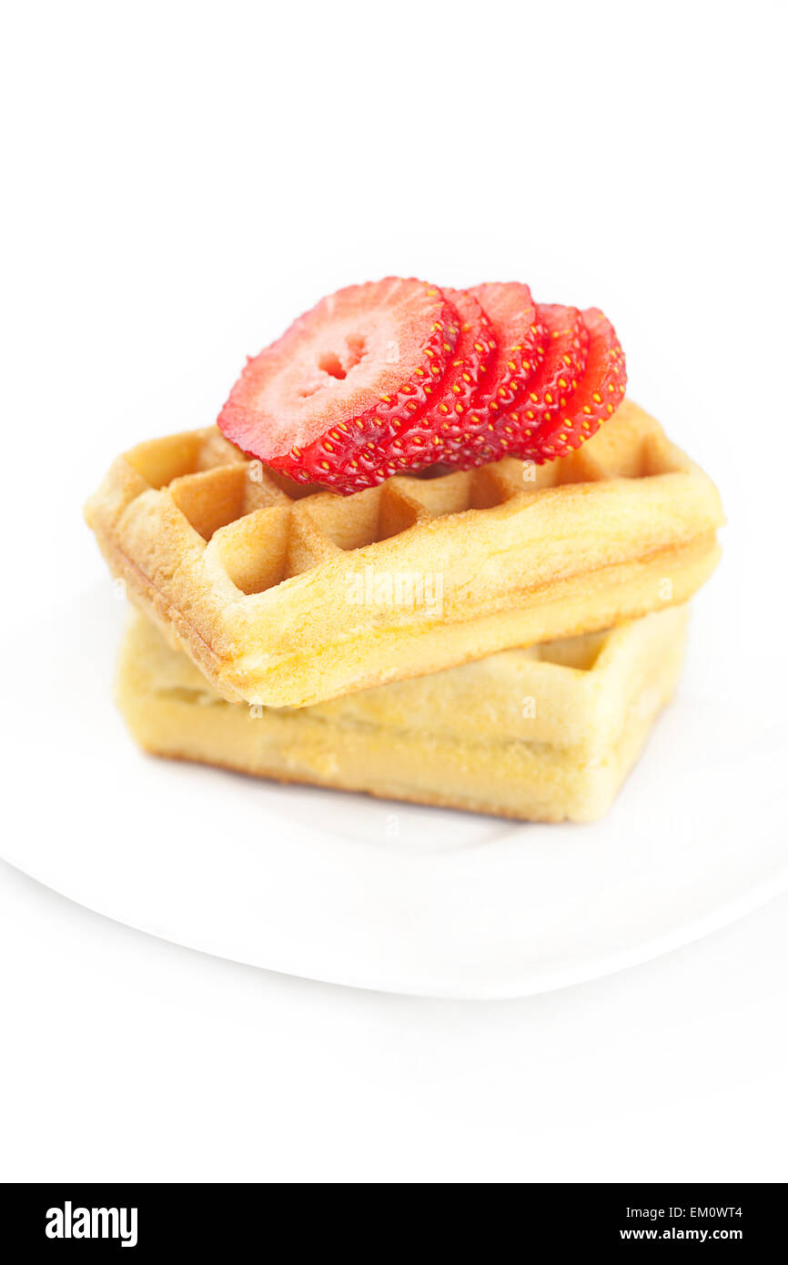 Belgian waffles and strawberry on a plate isolated on white Stock Photo ...