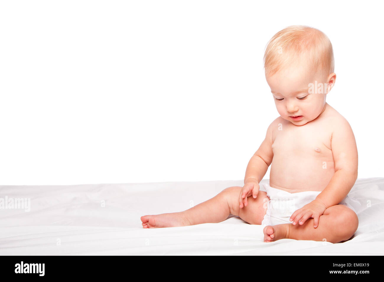 Cute lonely baby infant sitting Stock Photo - Alamy