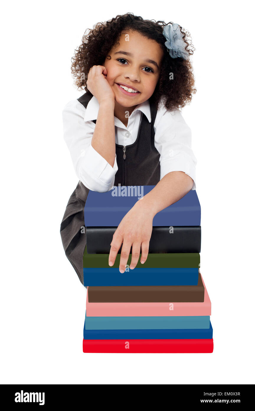 Happy school girl with stack of books Stock Photo - Alamy