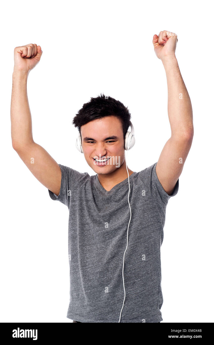 Guy enjoying music isolated over white Stock Photo - Alamy