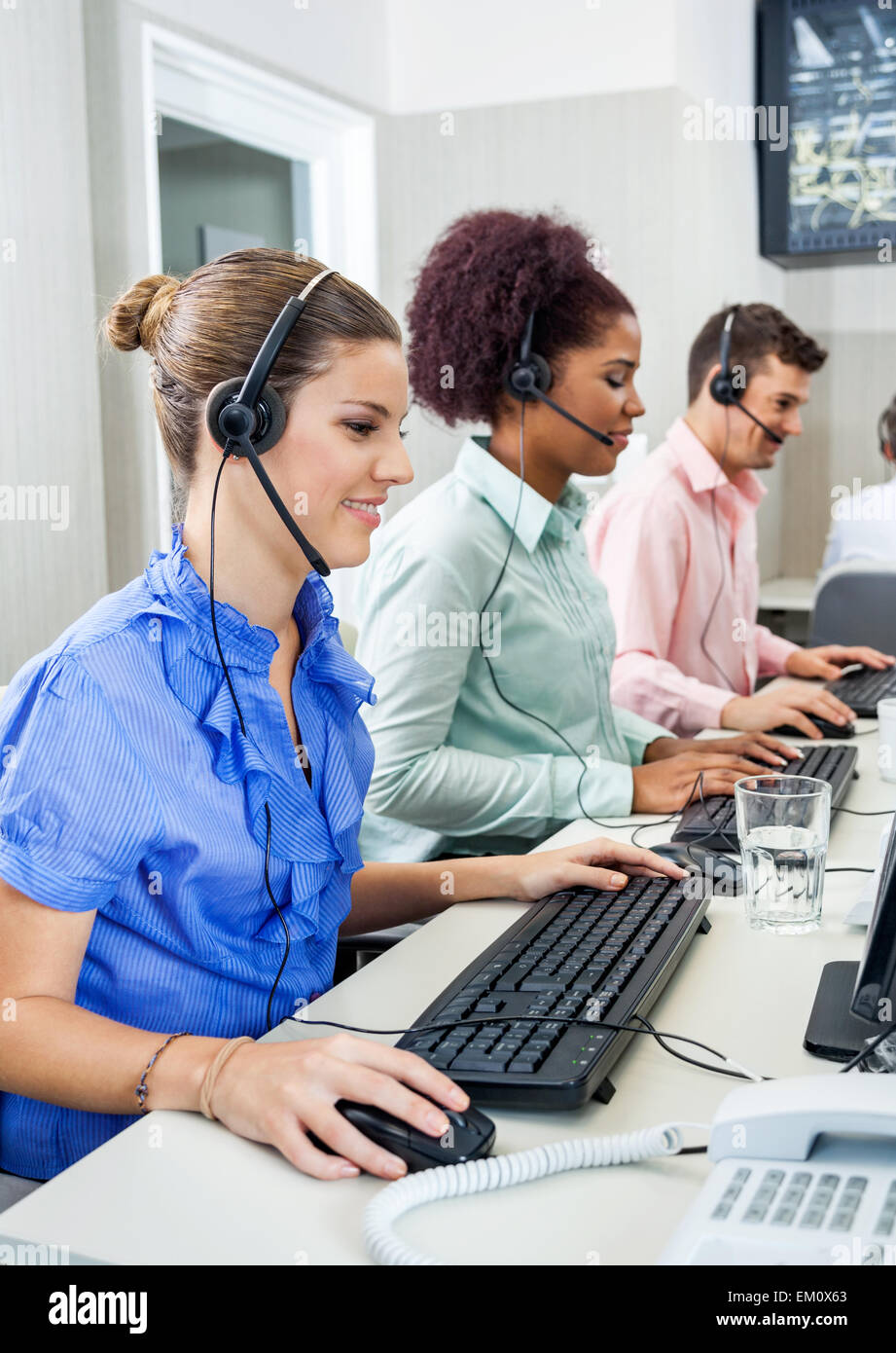 Customer Service Representatives Using Computers In Call Center Stock ...