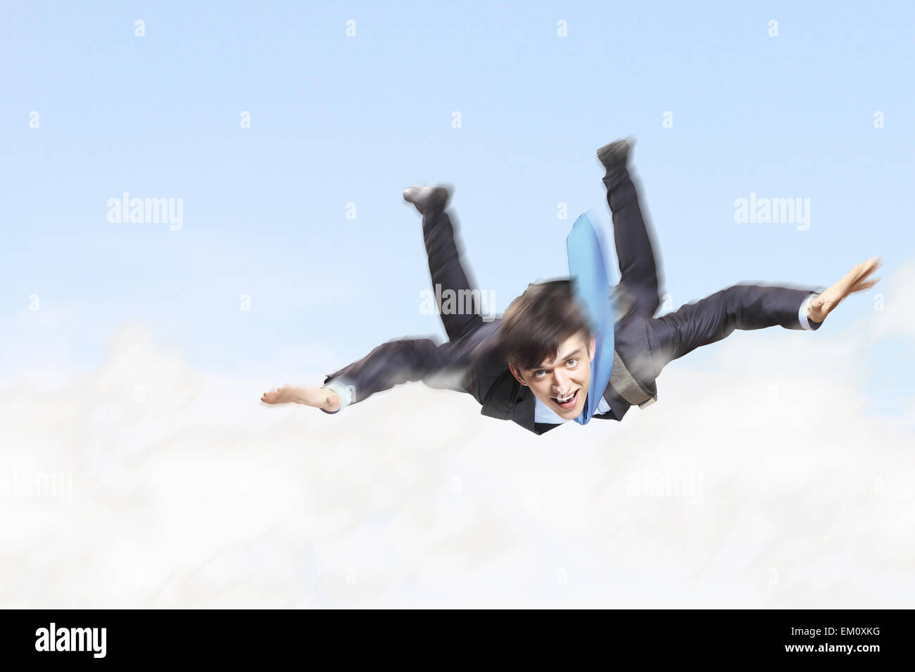 Young businessman flying with parachute on back Stock Photo - Alamy