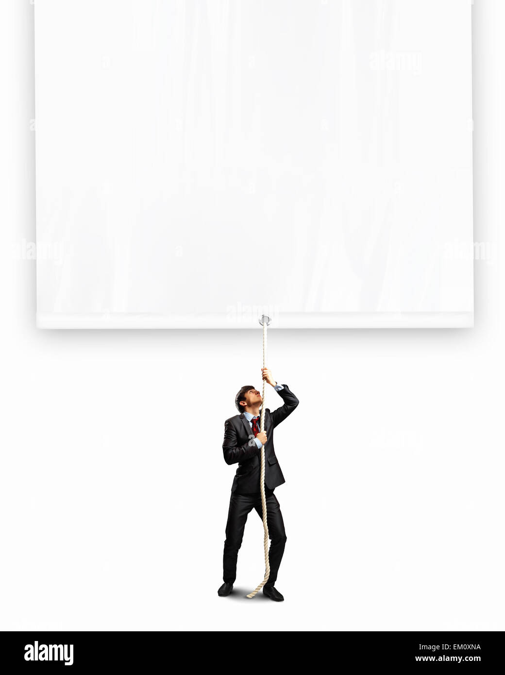 Businessman pulling blank banner Stock Photo - Alamy