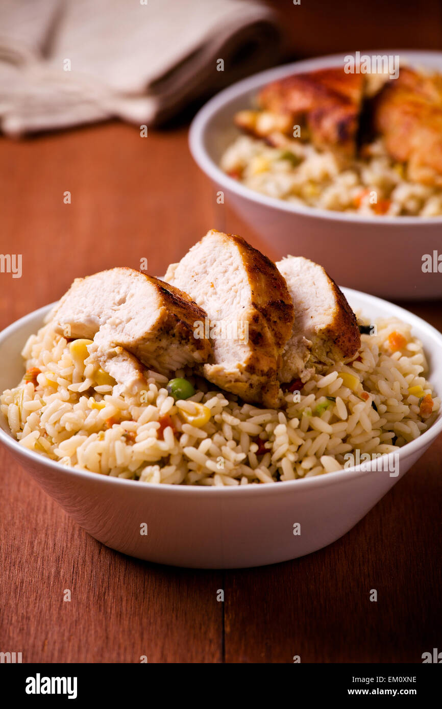 Close up photograph of a meal of chicken and rice with vegetables Stock ...