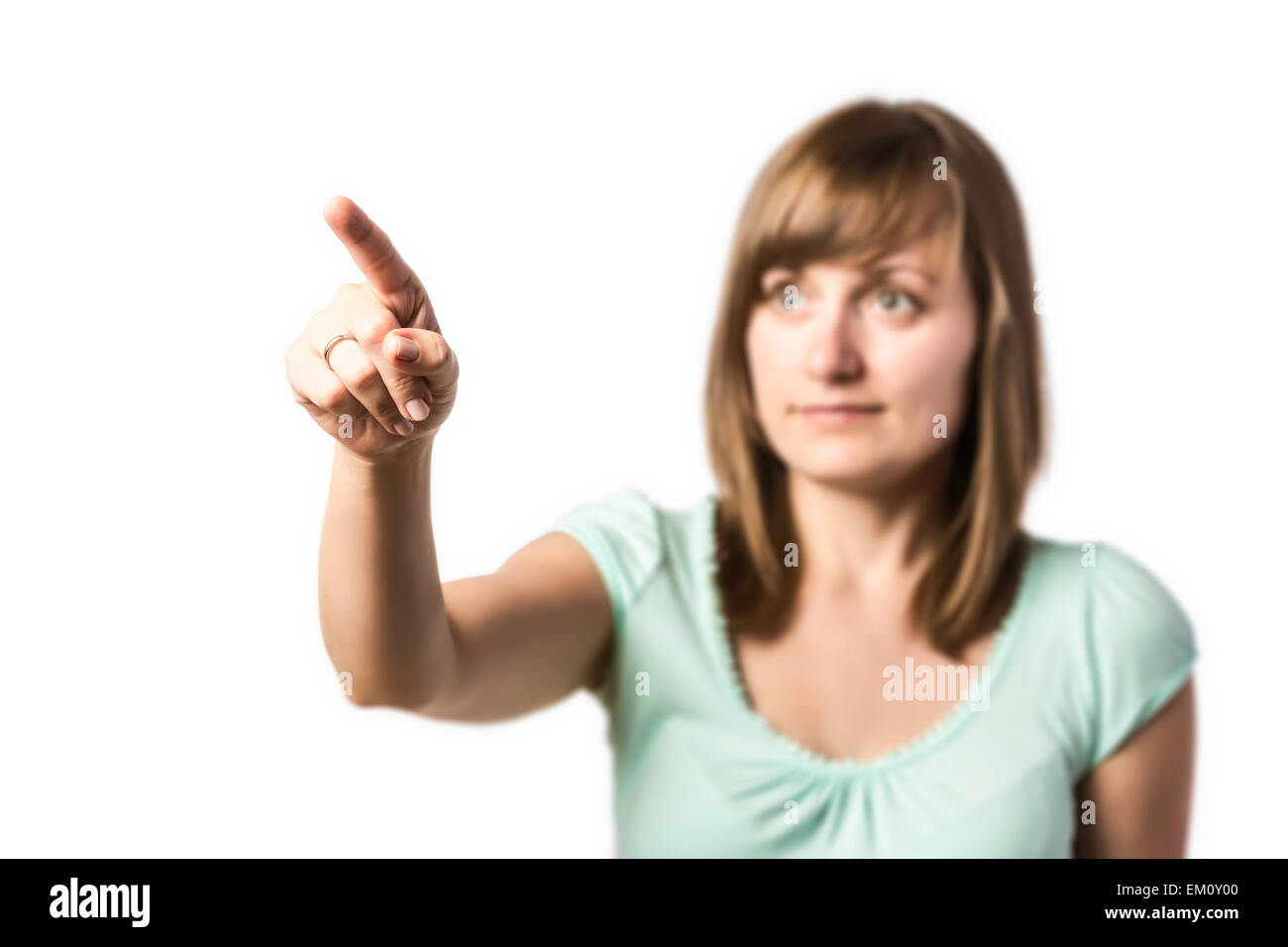 Pretty girl shows a finger at something Stock Photo - Alamy