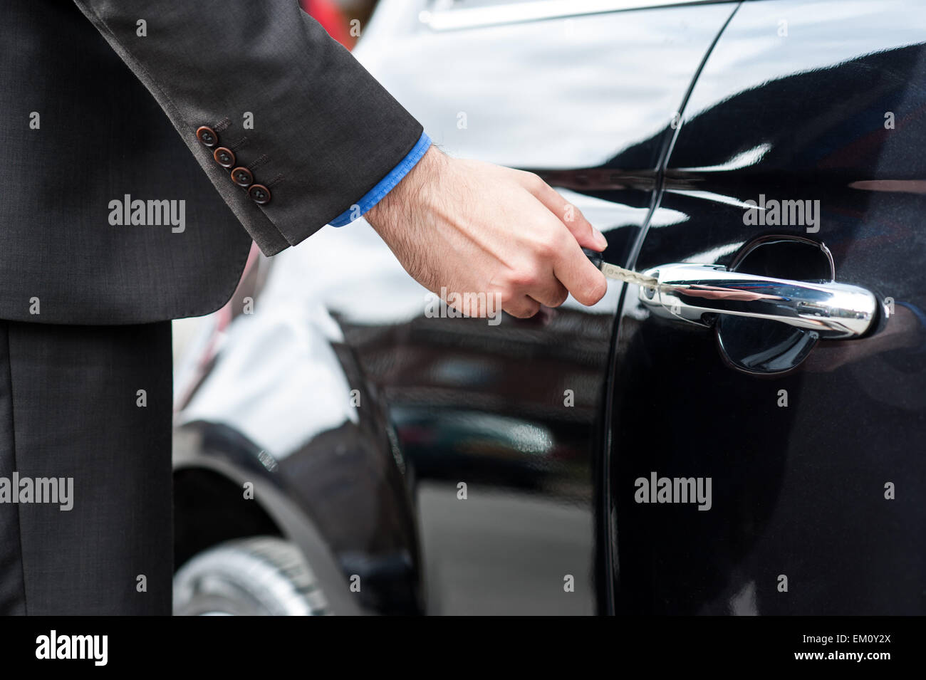 Man hand inserting key hi-res stock photography and images - Alamy