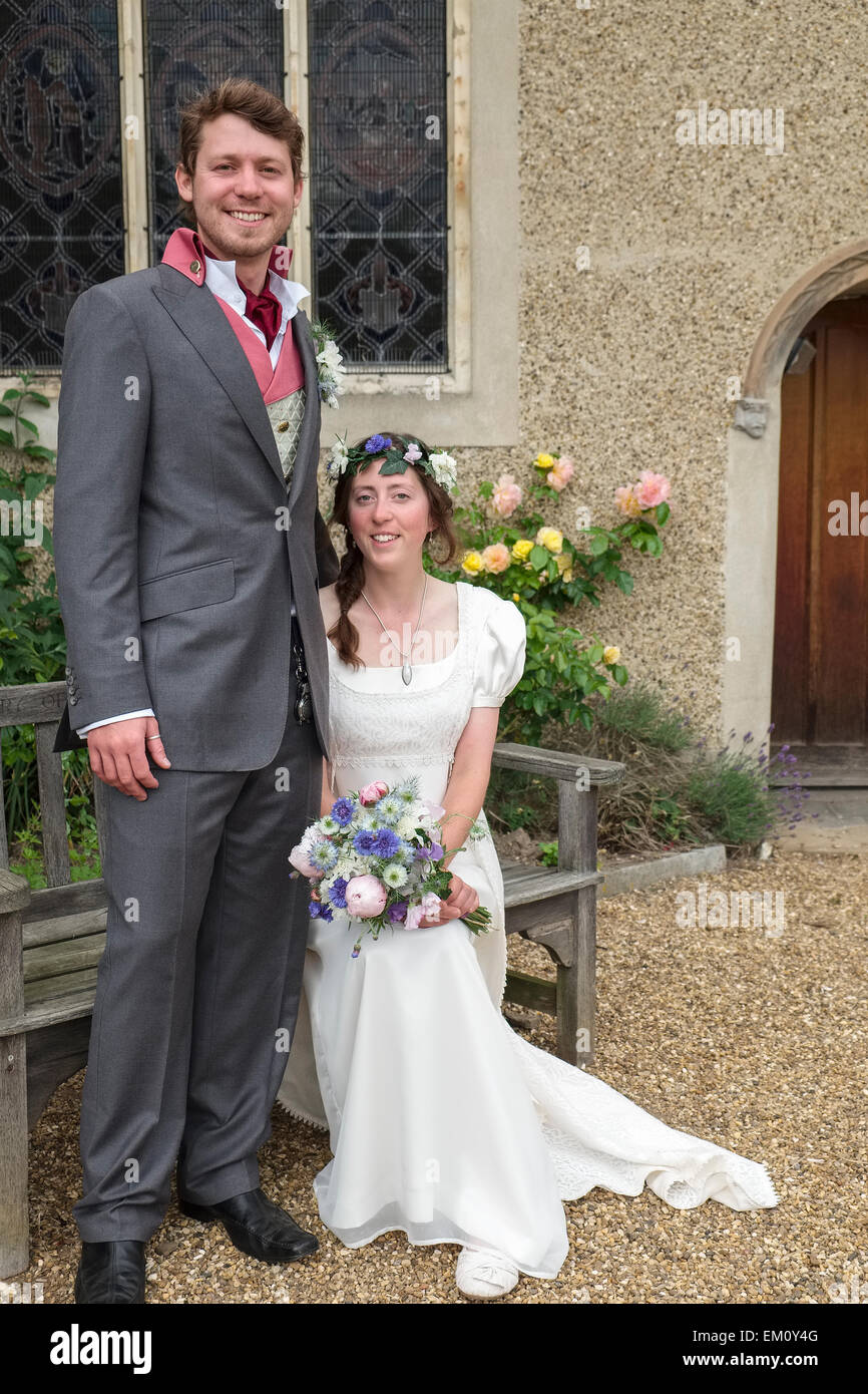 Bride and Bridegroom posing together outside Church after Wedding ...