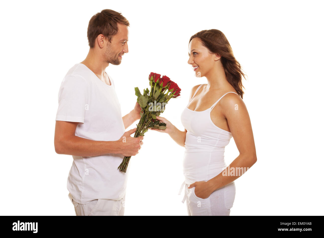 Husband offering a rose to his happy wife Stock Photo - Alamy