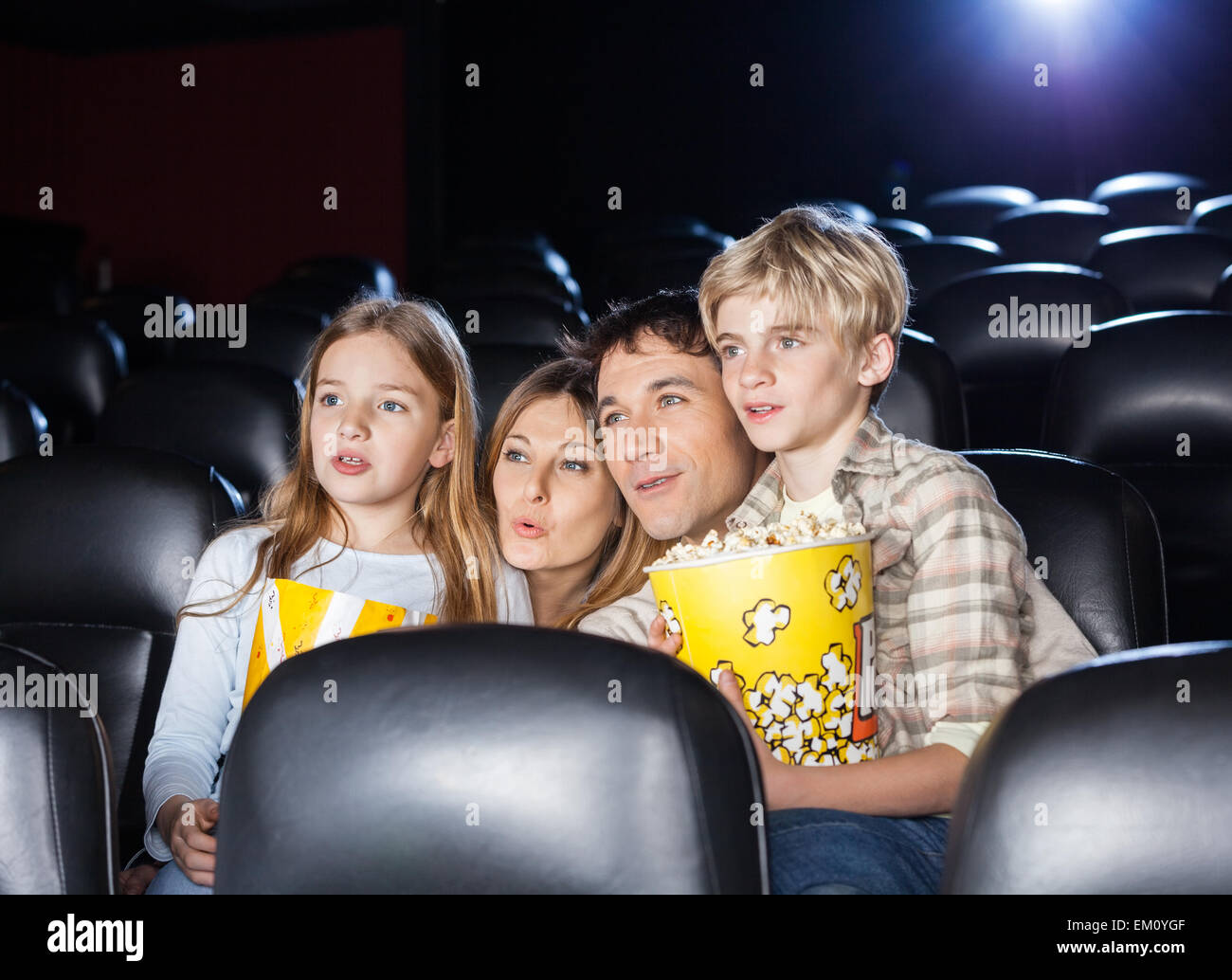 Family at movie theatre hi-res stock photography and images - Alamy